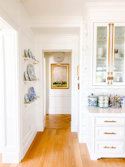 French-Style Shelves with Brass Tipping Rails - Randi Garrett Design